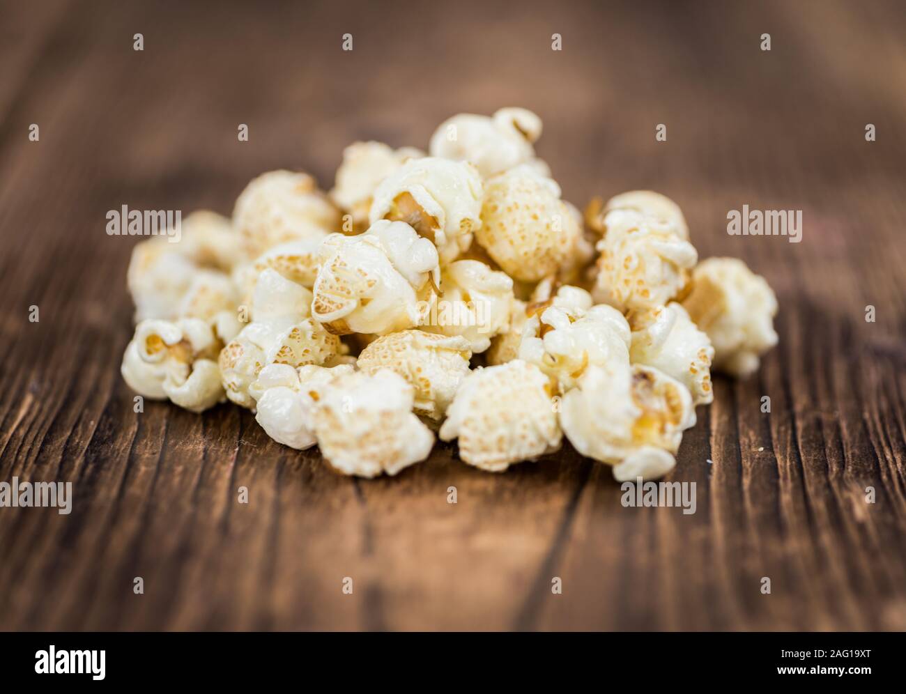 Fresh made Popcorn on a vintage background as detailed close-up shot ...