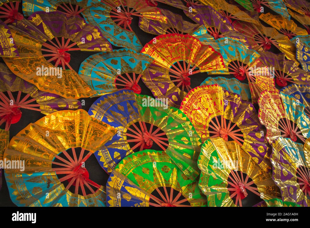 Traditional hand fan on display as a photography background Stock Photo ...