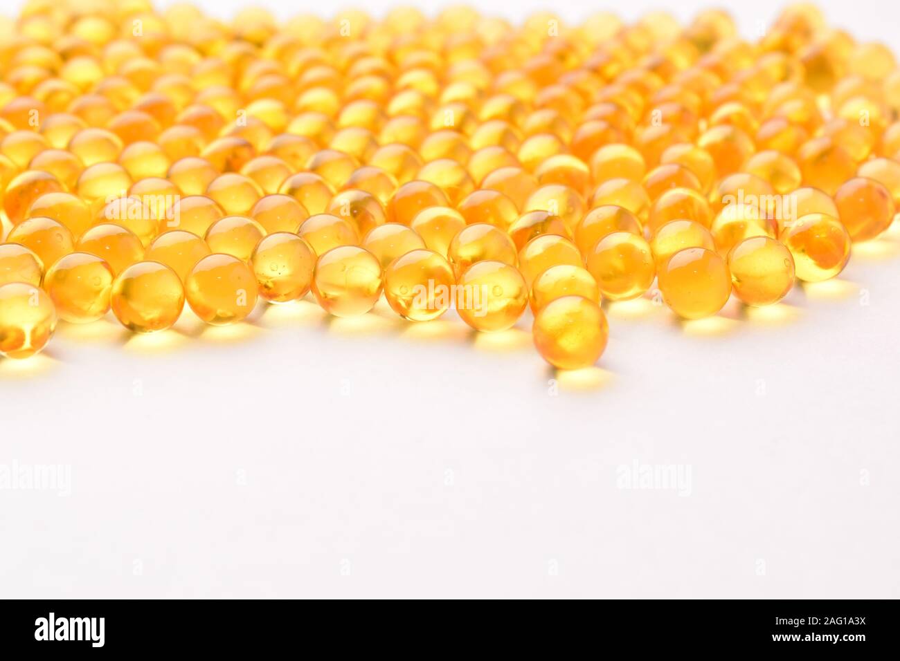 fish oil pills arranged on white background Stock Photo - Alamy