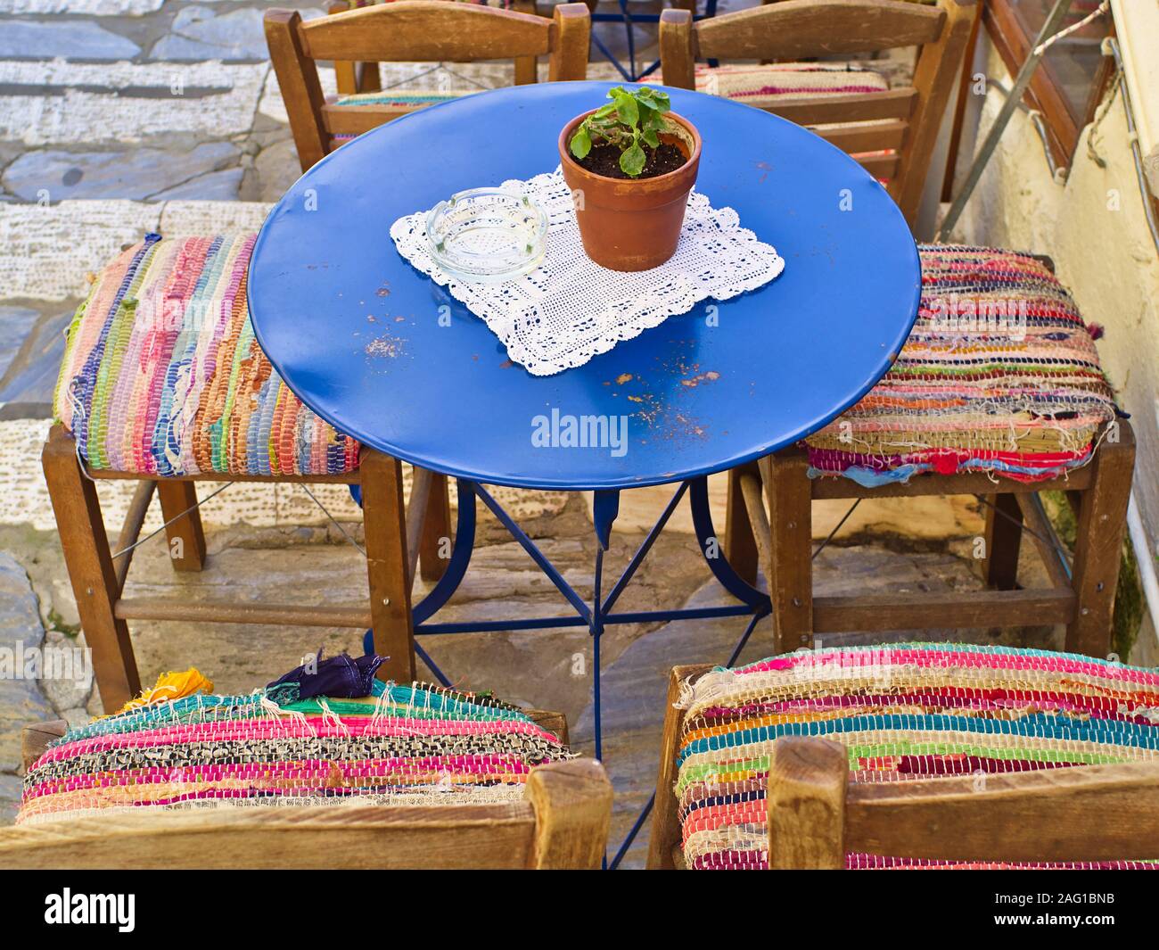 Plaka, Athens, cafe blue table with rustic doily cover with lace and ...