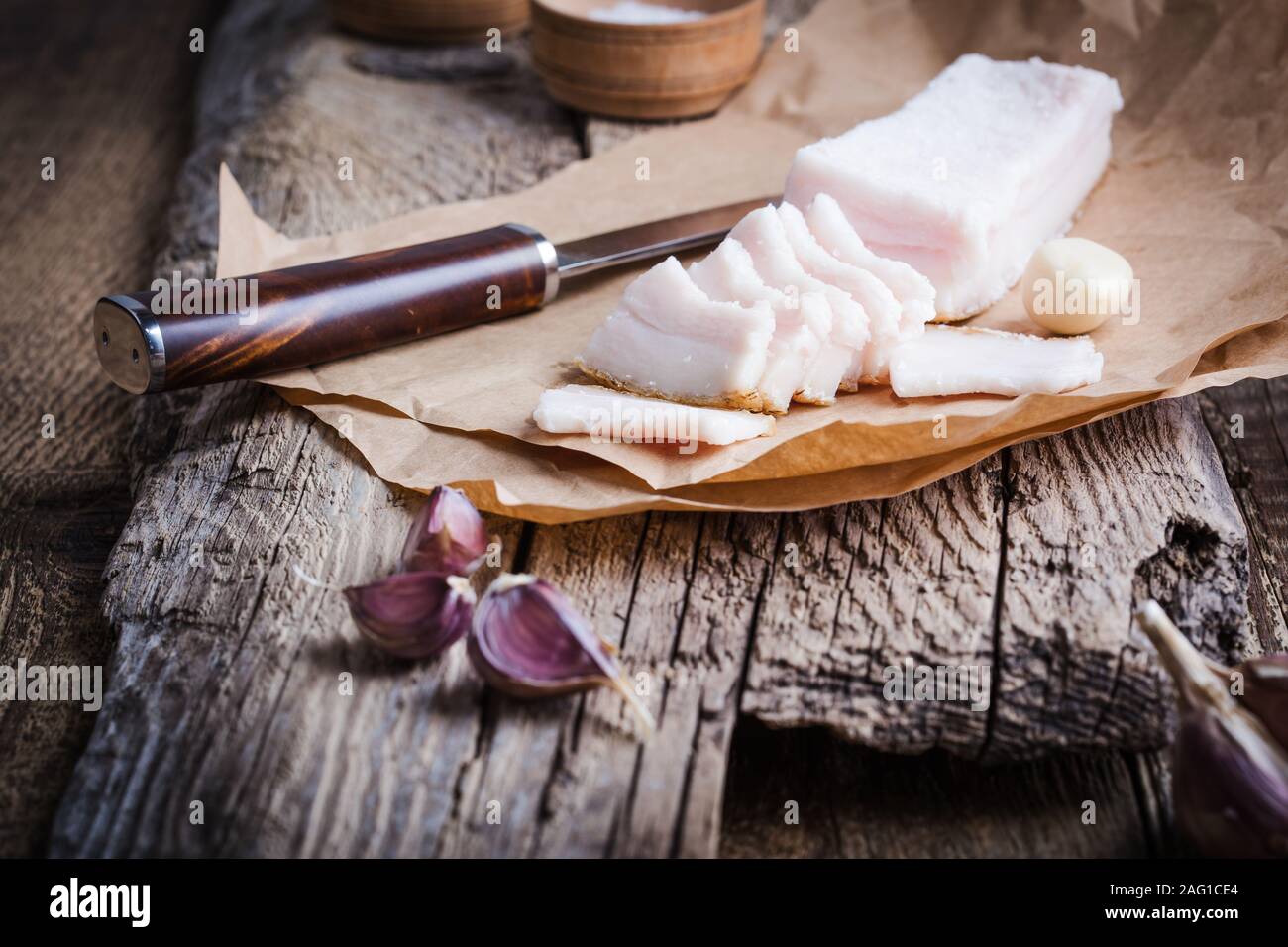 Traditional Ukrainian appetizer, raw lard with garlic and salt on ...