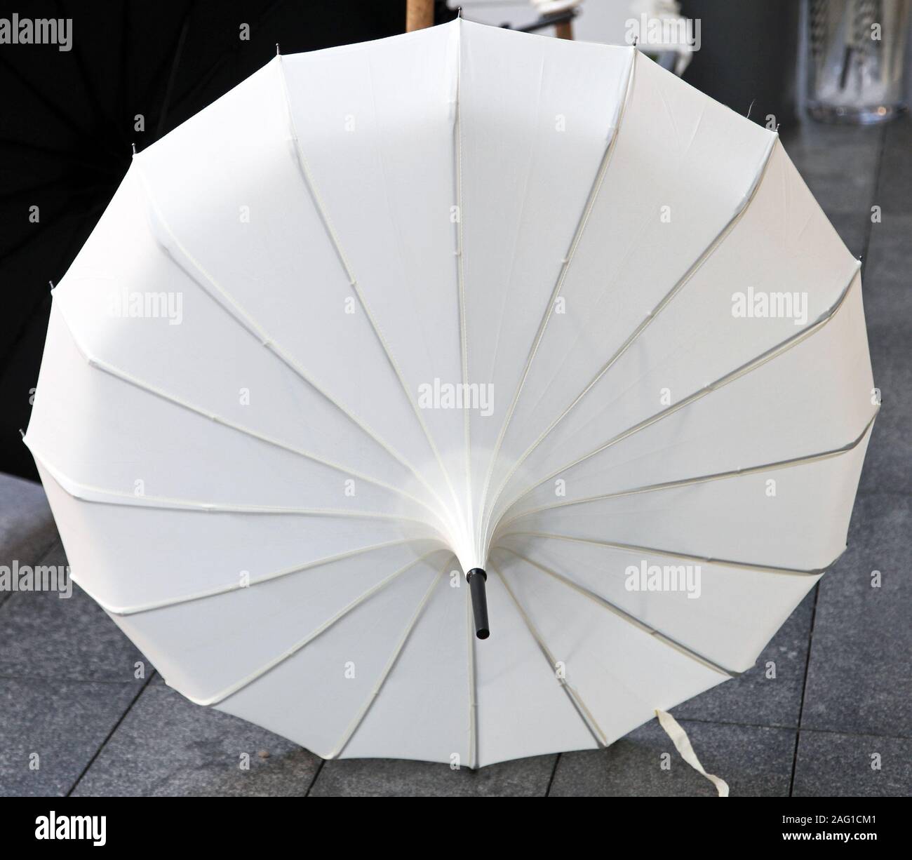 Minimalistic white parasol in open position Stock Photo - Alamy