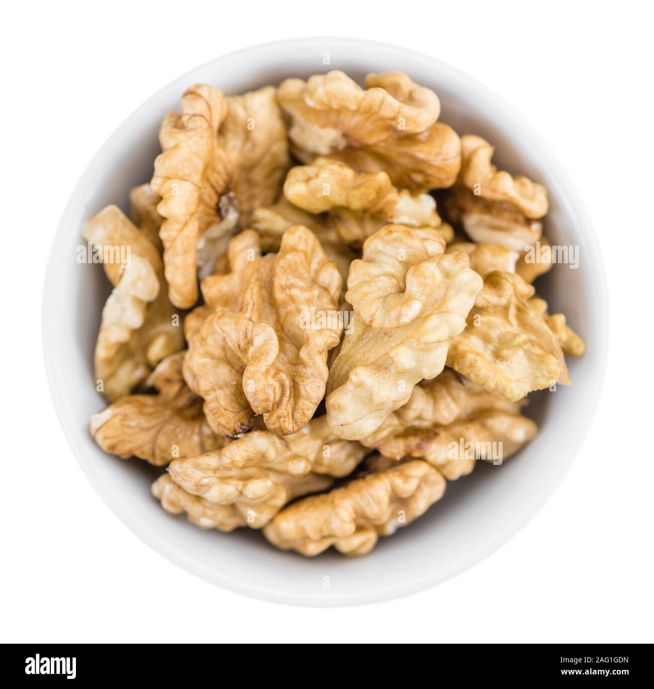 Portion of Walnut kernels (as close-up shot) isolated on white ...