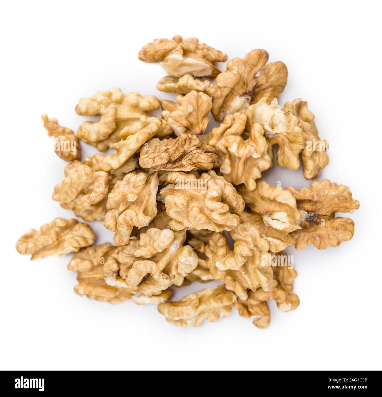 Portion of Walnut kernels (as close-up shot) isolated on white ...