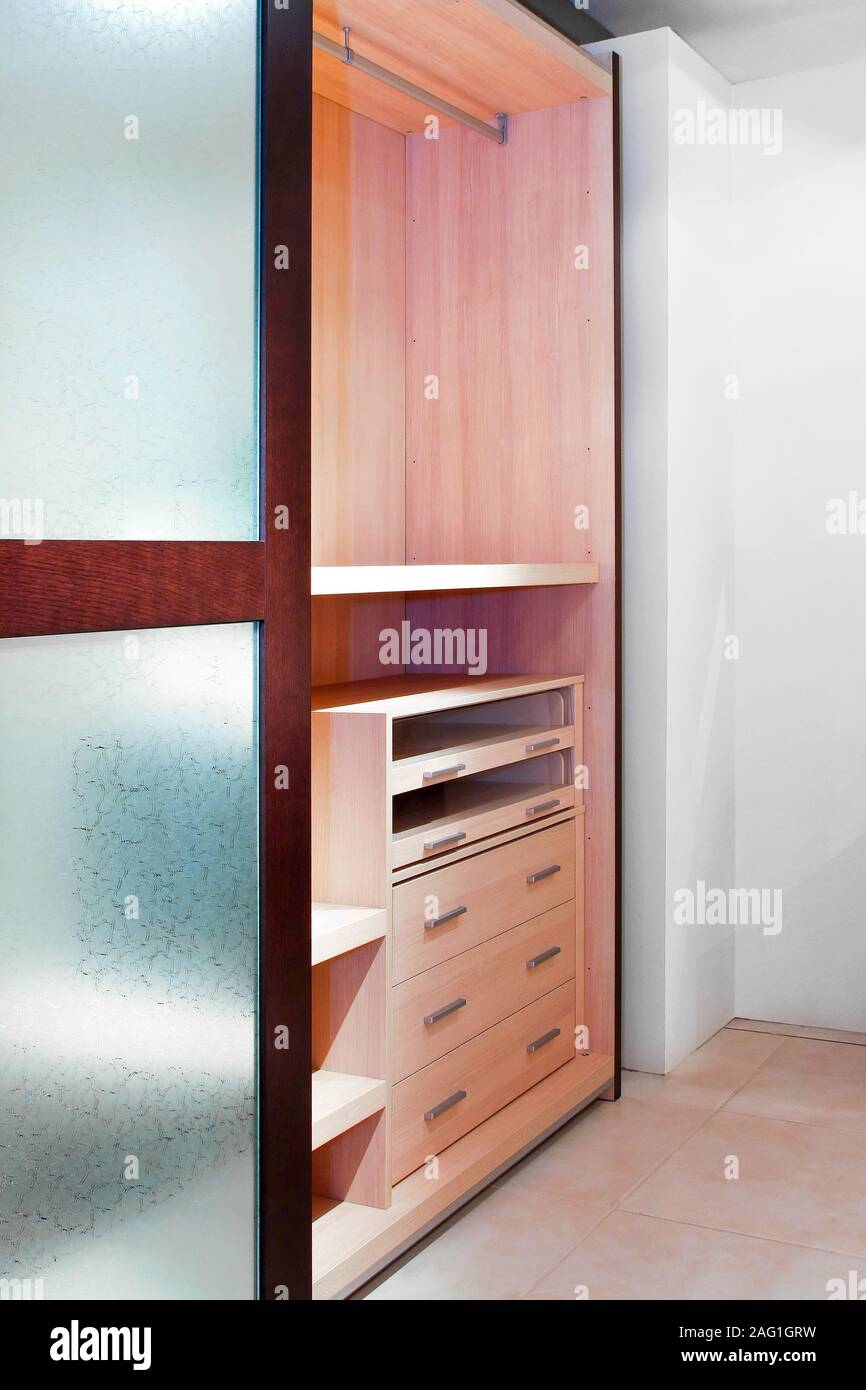 Inside of an empty wardrobe with shelves Stock Photo - Alamy