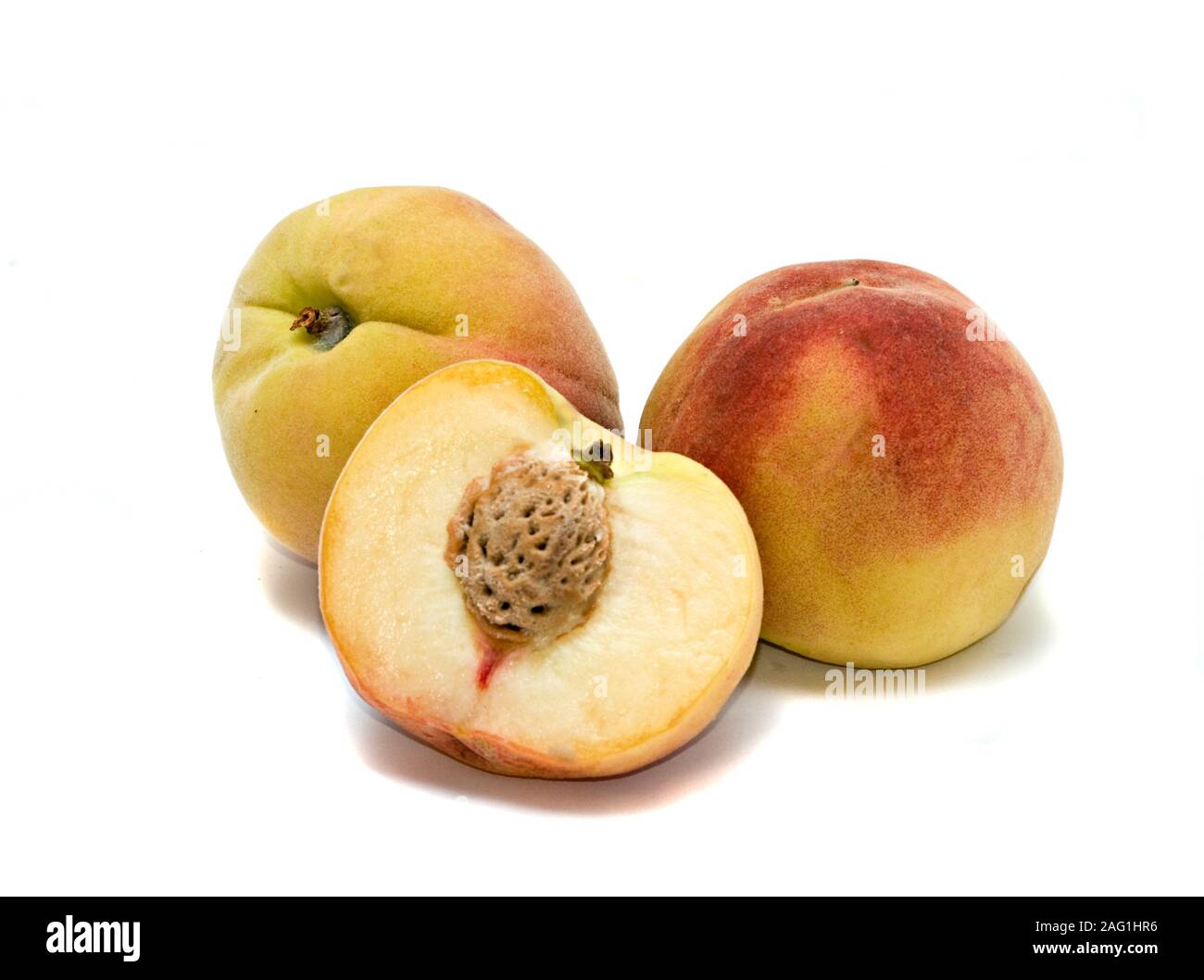 Peaches and section isolated on white background Stock Photo - Alamy