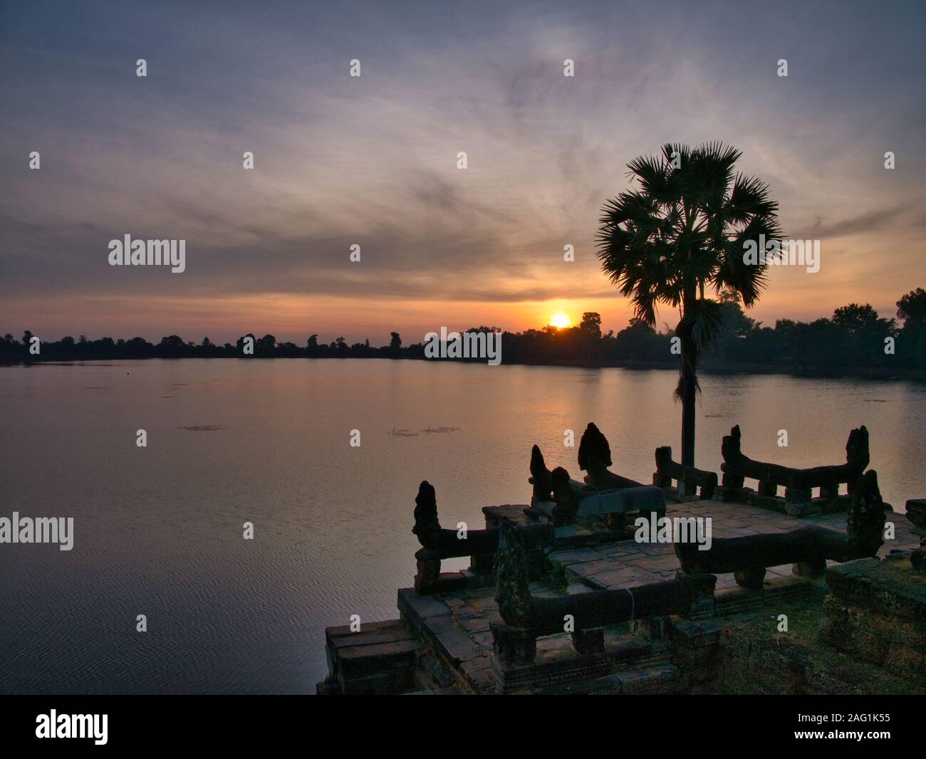 Sunrise over the ancient bathing pool of Sras Srang, part of the Angkor ...