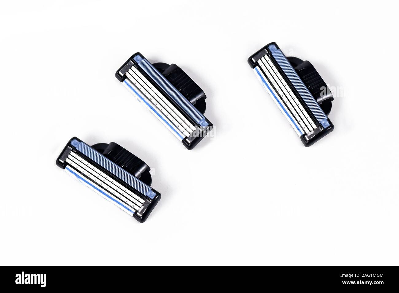 Three razor heads for men's hand held facial razor on white background ...