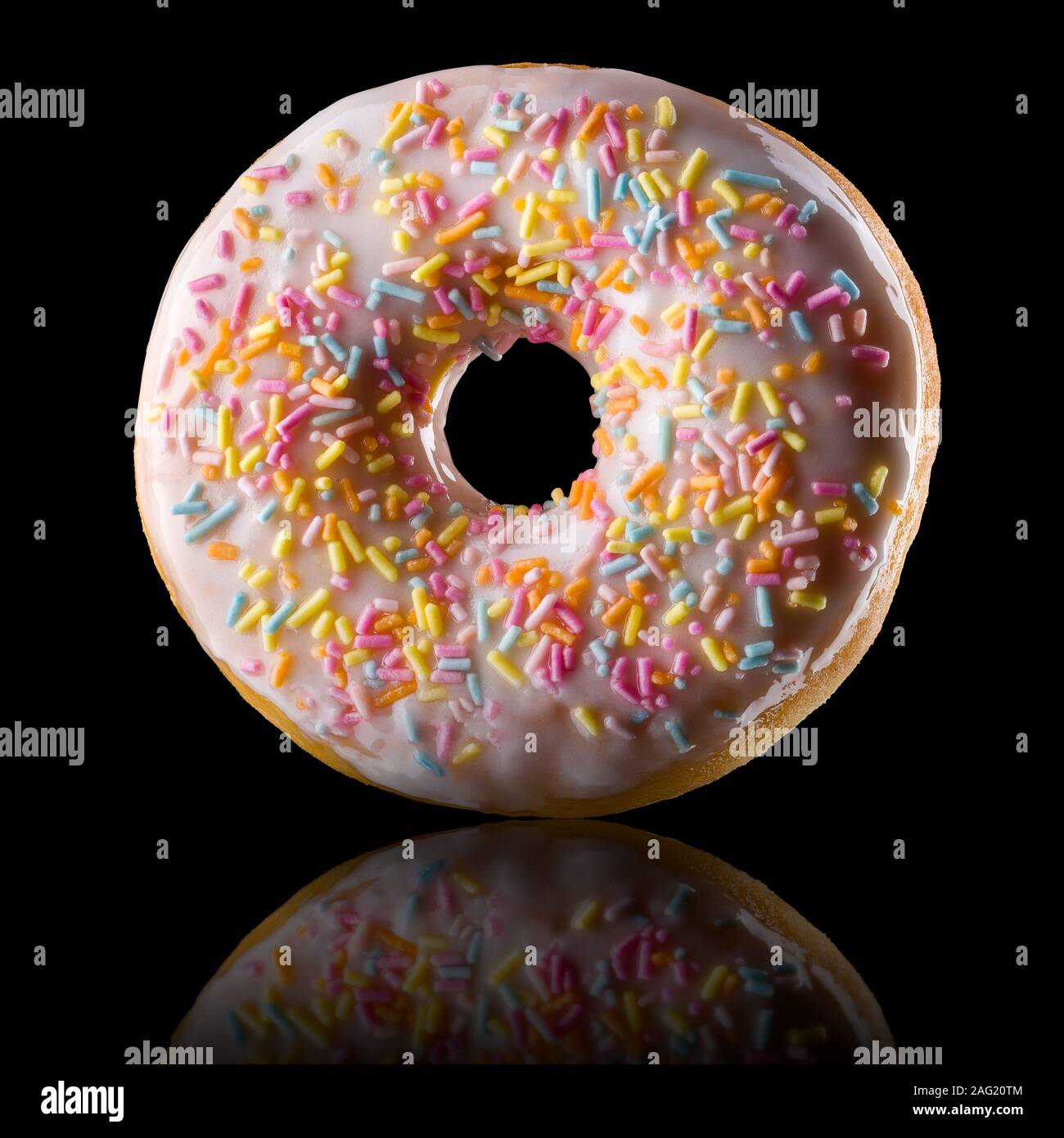 Glazed donut with reflection on a black background rotated in three ...