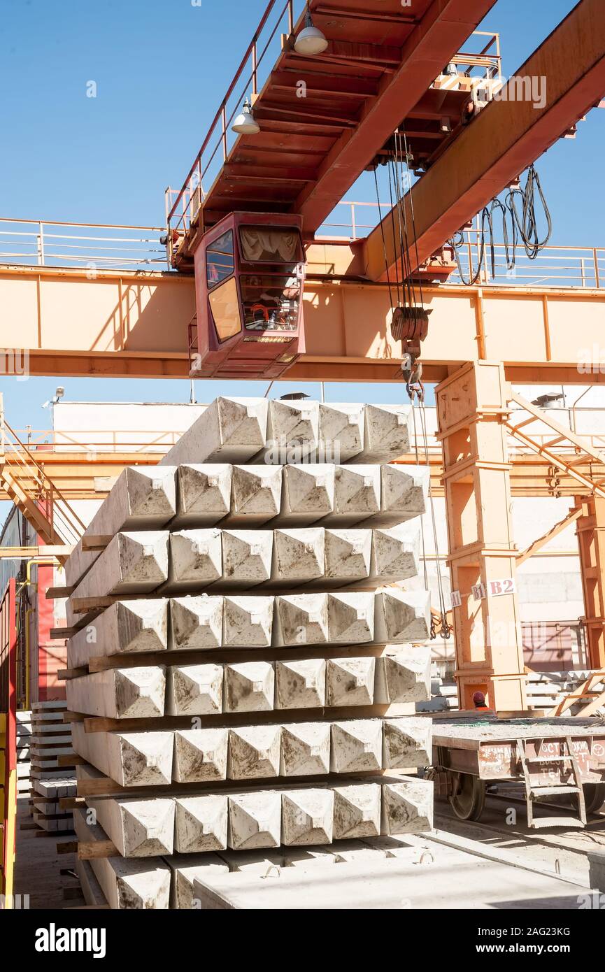 Crane operator works at finished good warehouse Stock Photo - Alamy