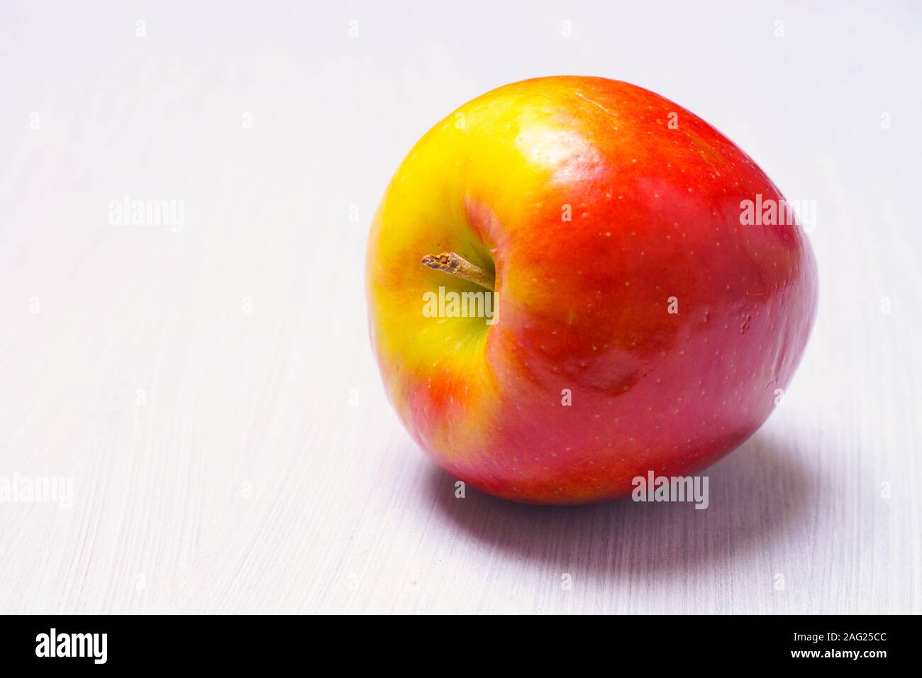 Photograph of a bright red apple isolated on white background with lots ...