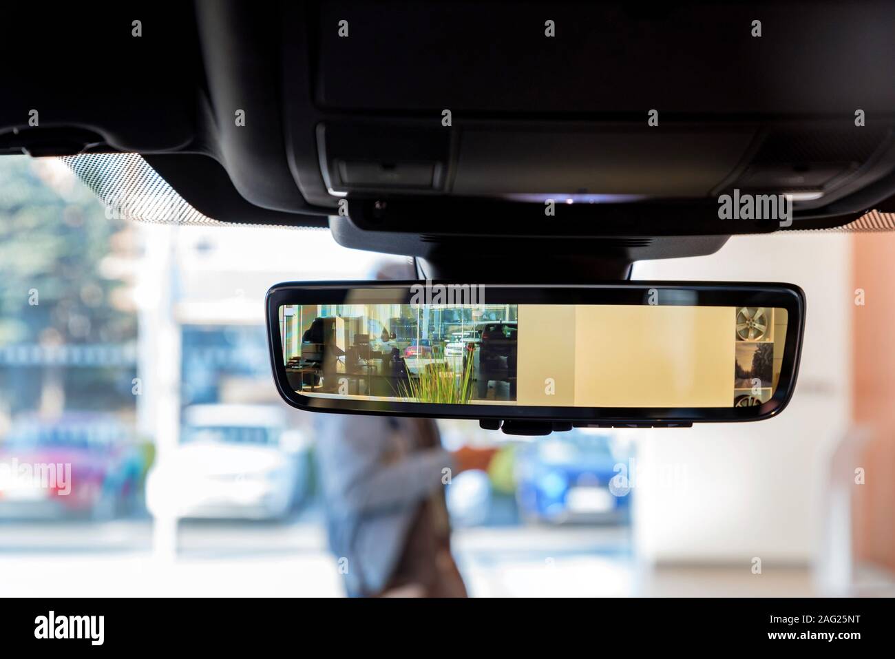 Close up modern rear view mirror that shows image from camera on a ...