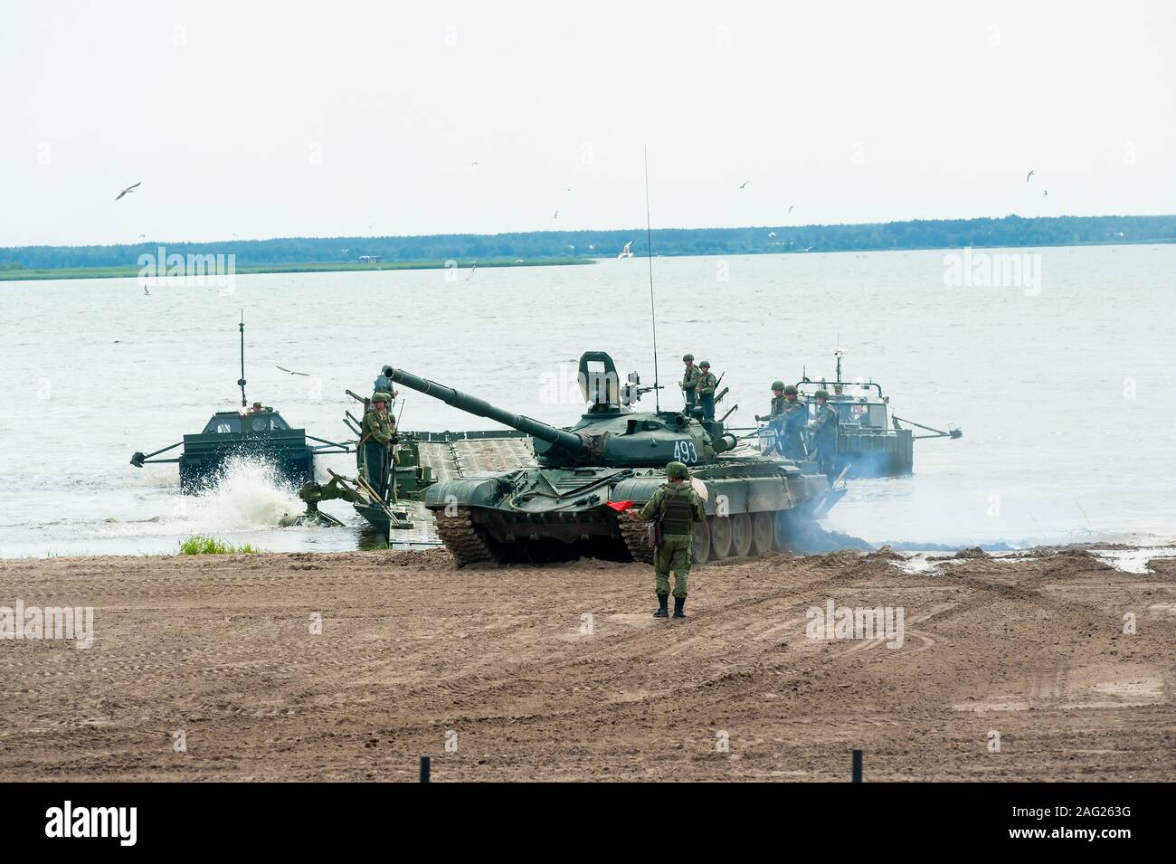 Large pontoon boats transporting tanks Stock Photo - Alamy