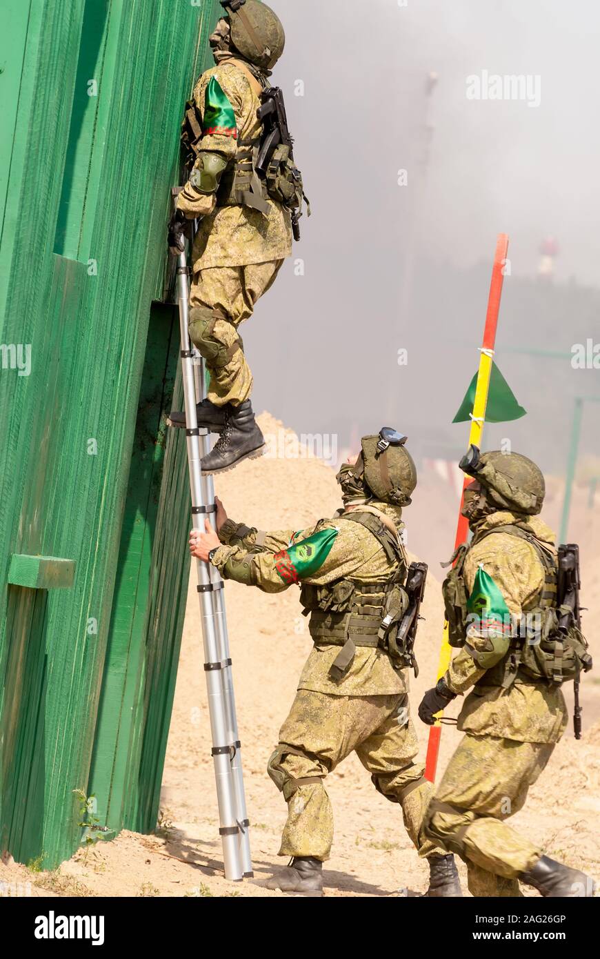 Military officers climbing on wall at Army Games Stock Photo - Alamy