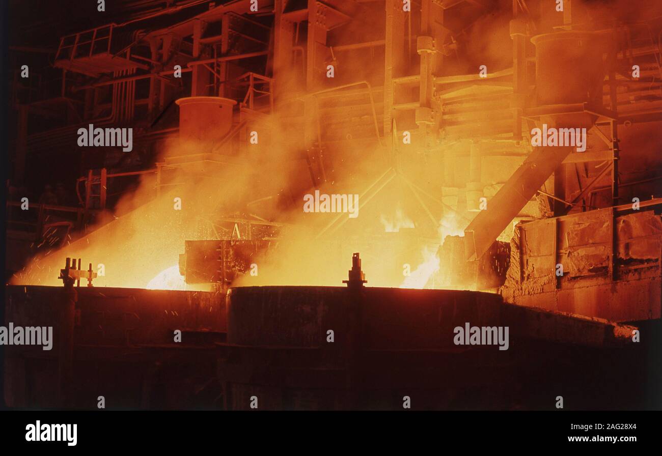 1960s, historical, giant steelworks, Wuhan, China, showing an orange ...