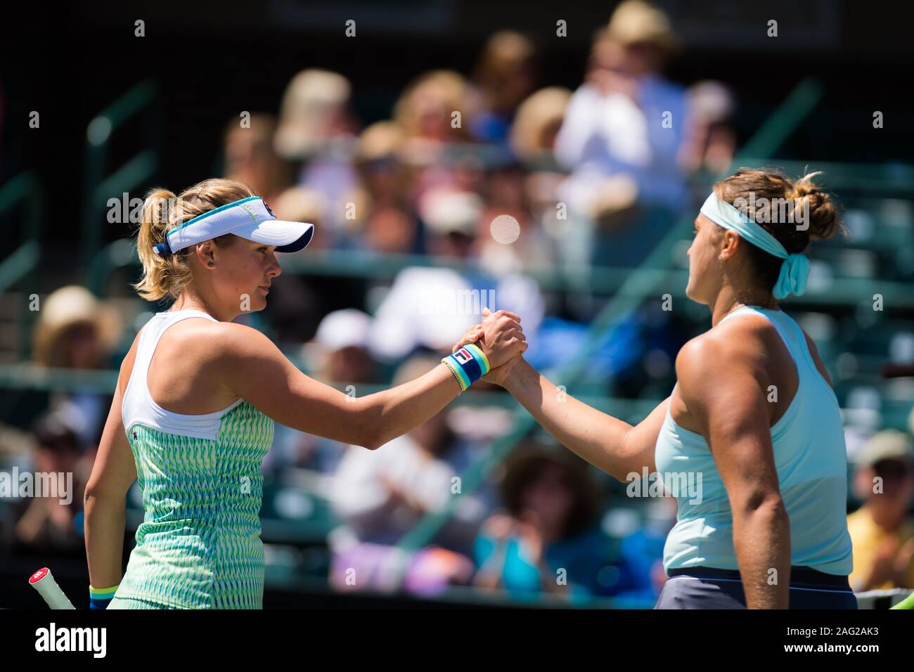 Kateryna Kozlova of the Ukraine & Aryna Sabalenka of Belarus at the net ...