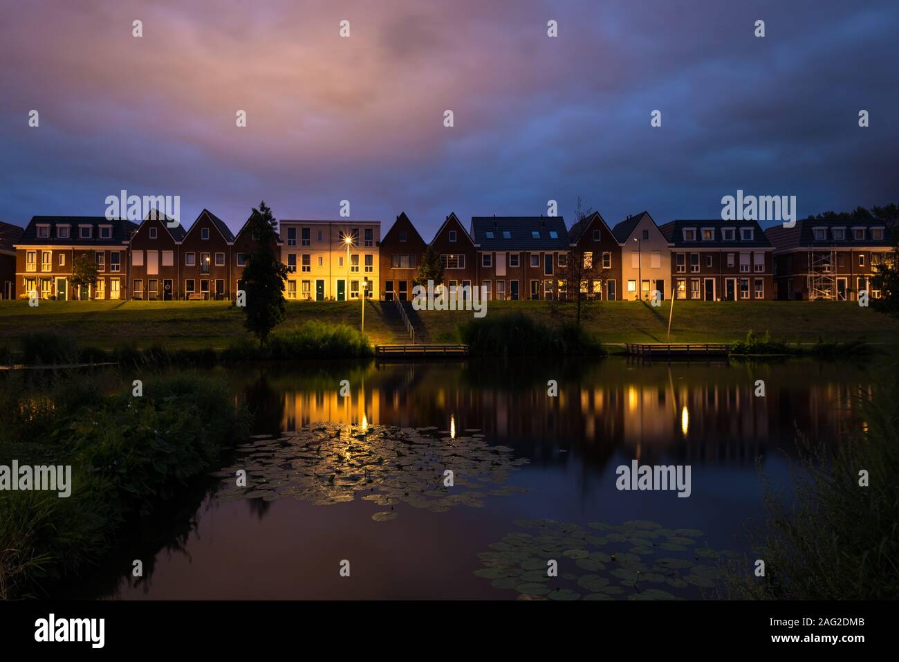 Modern architecture in classical dutch style along the waterside in a ...