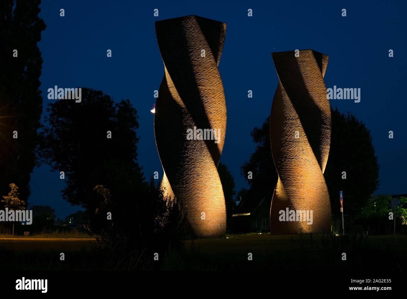 Modern architecture in the form of a textured brick wall in the shape ...