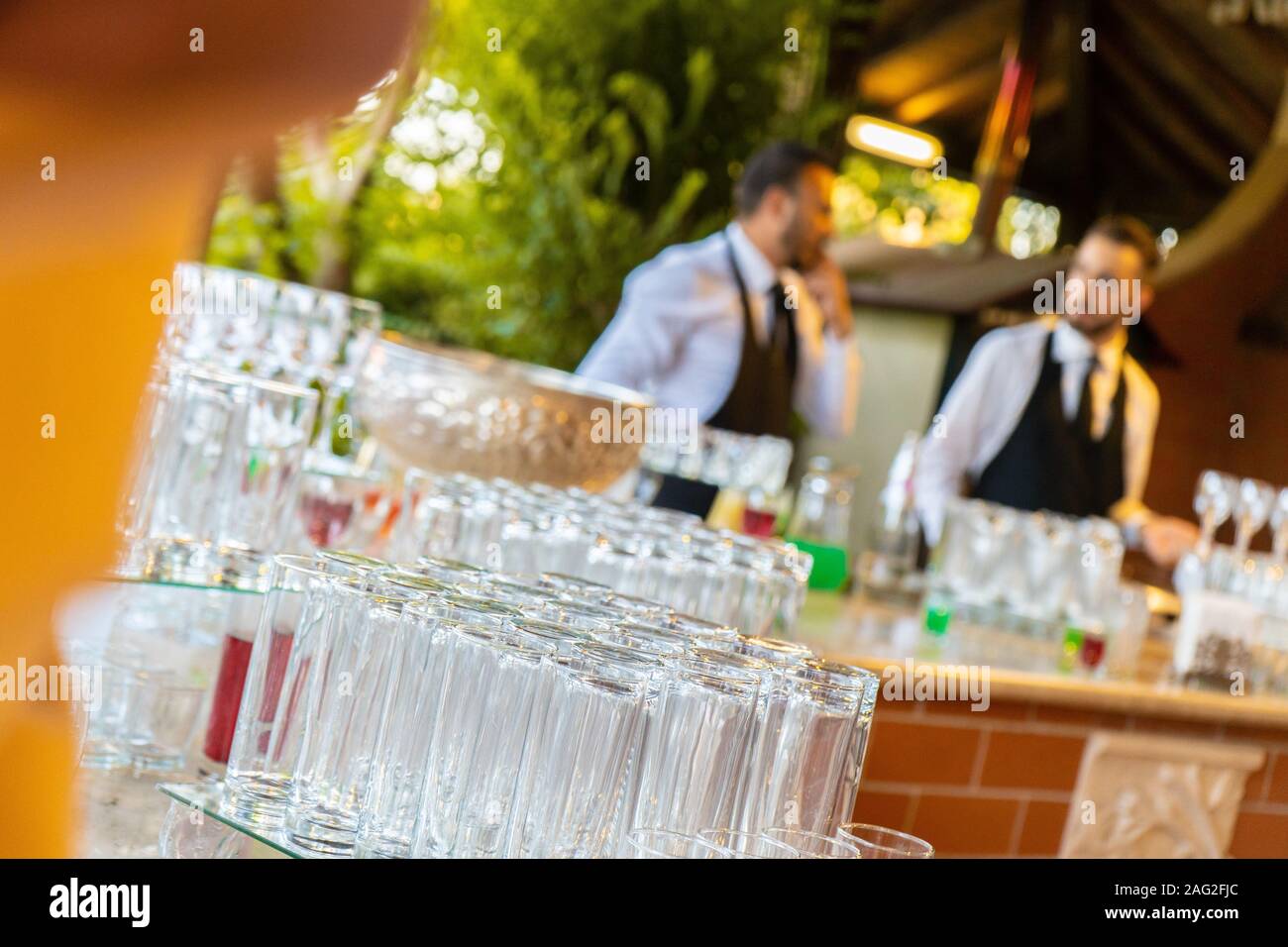 Waiters at a banquet getting ready for an aperitif Stock Photo - Alamy