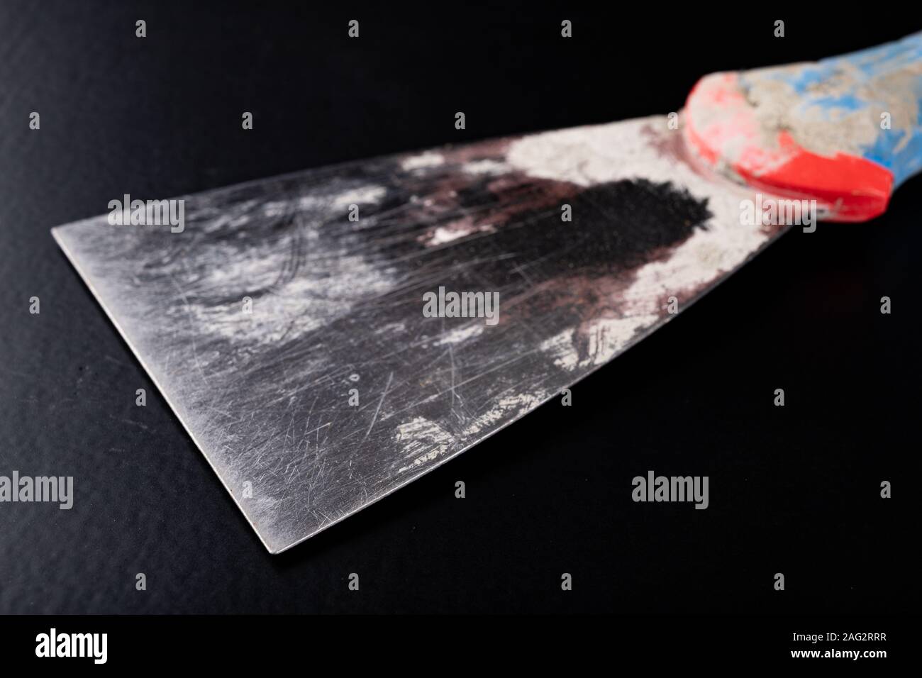 Scratched and dirty plaster spatula. Construction tools for employees ...