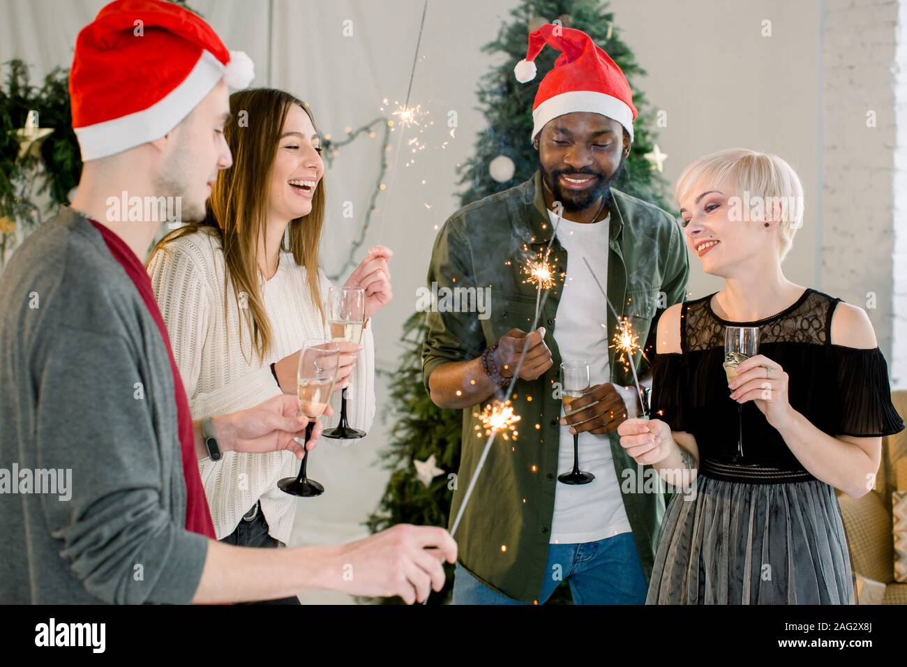 happy international group of friends having fun with glasses of ...