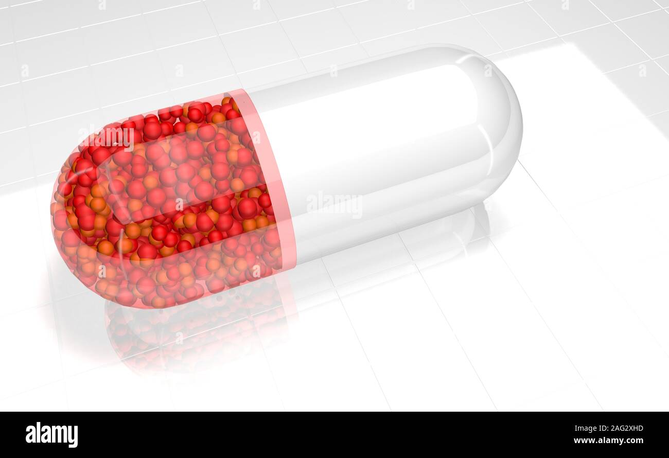 Close up on white plastic capsule with transparent red half full of red ...