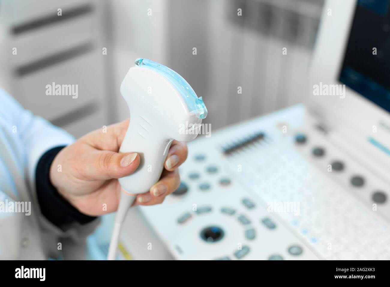 Doctor prepare an ultrasound machine for the diagnosis of a patient ...