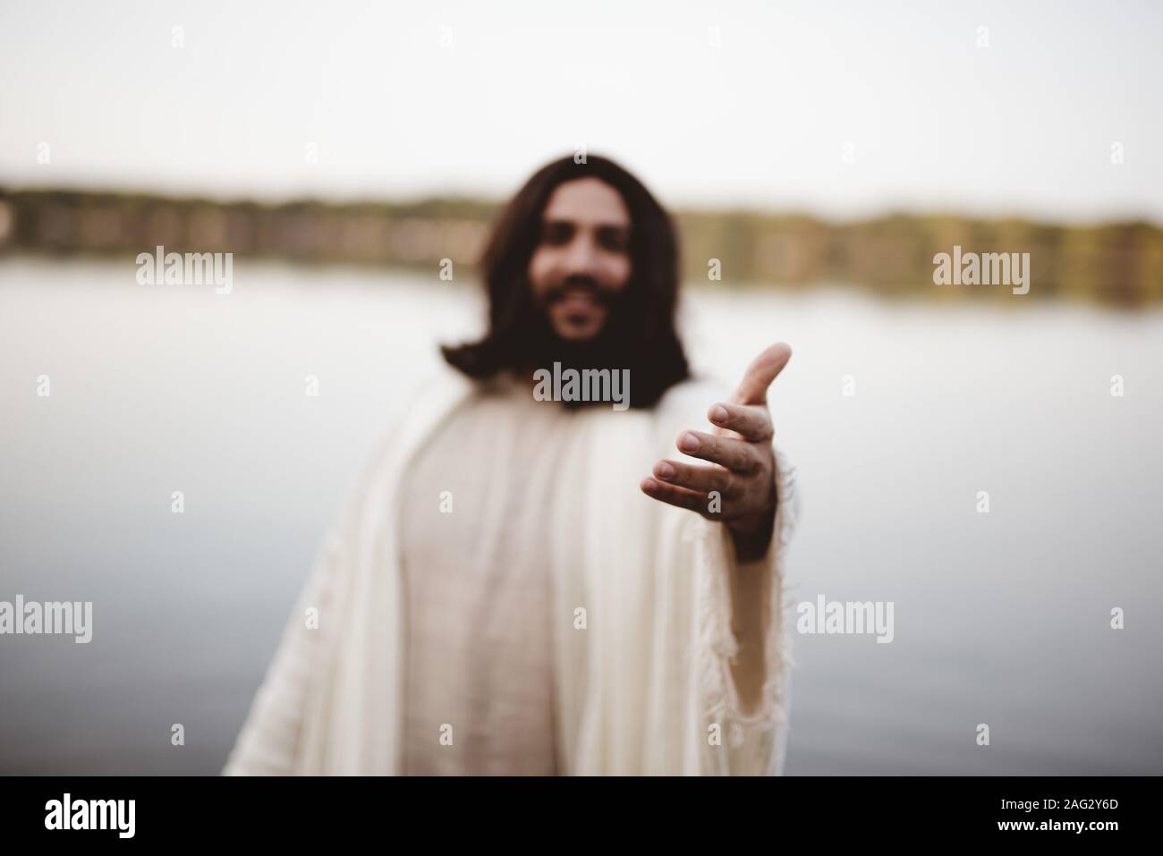 Jesus Christ lending a helping hand with a blurred background Stock ...