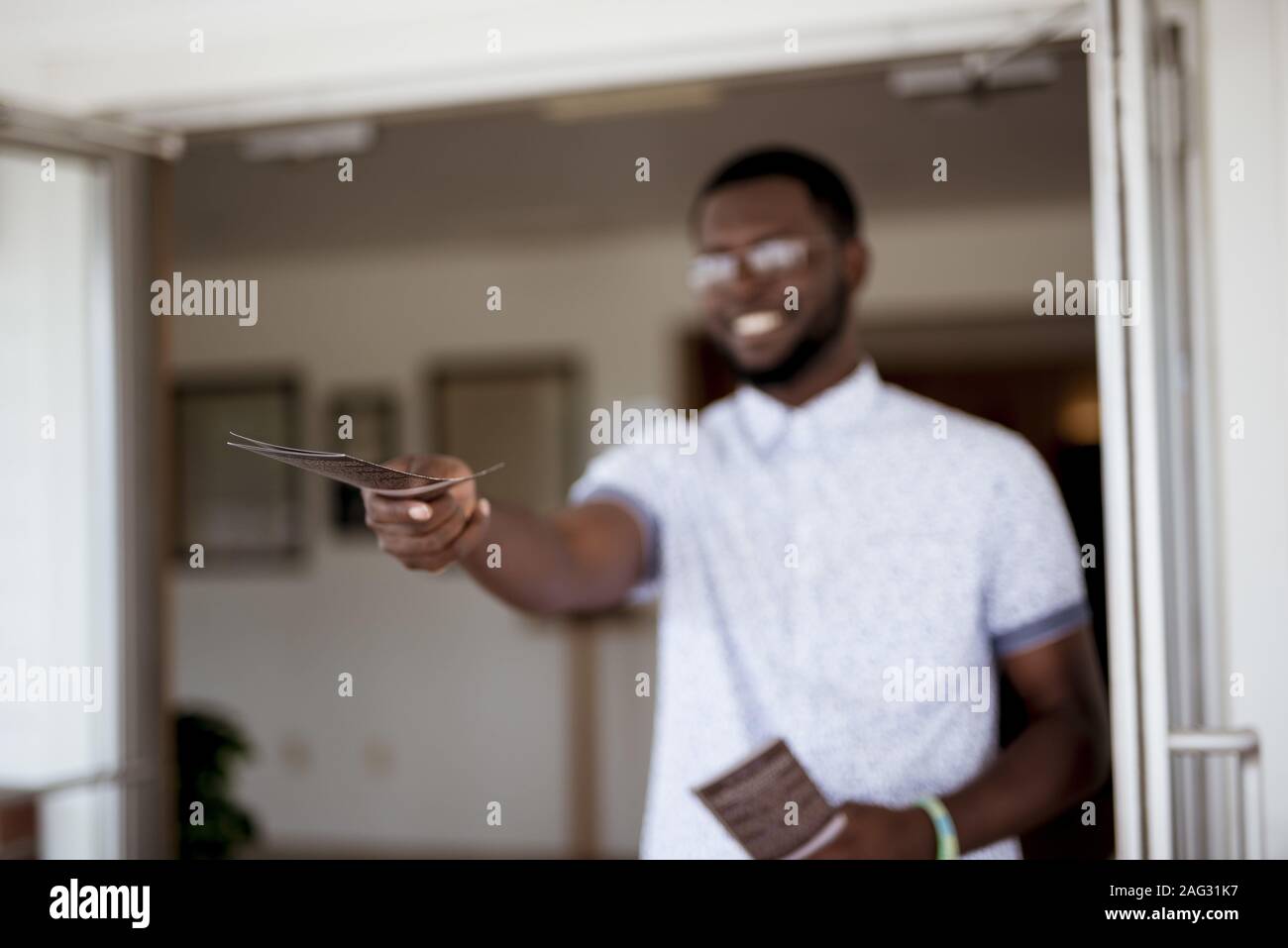 Giving out flyer hi-res stock photography and images - Alamy