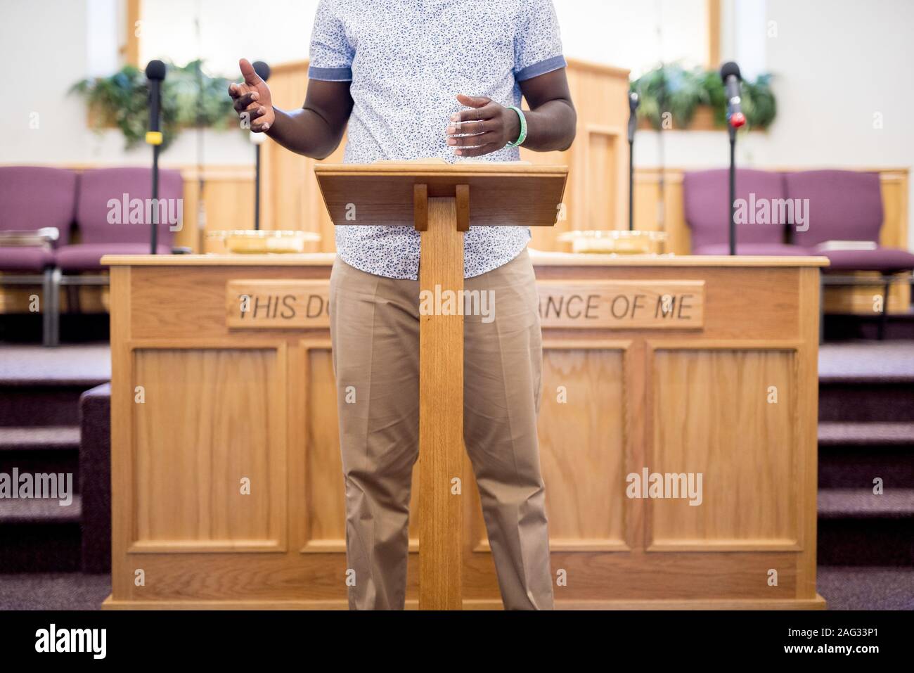 Person reading the bible on a wooden stand in the church Stock Photo ...