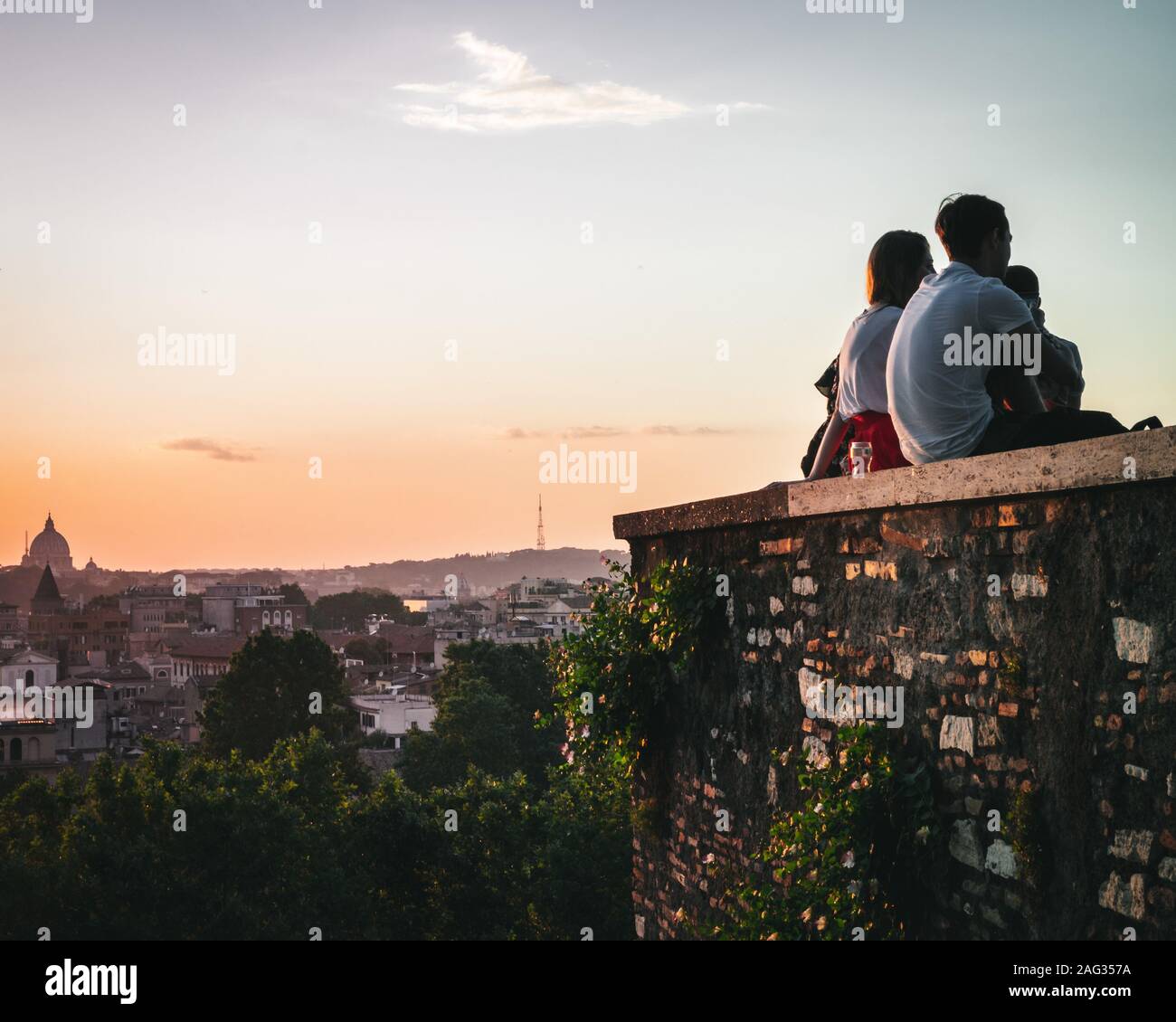 Family sitting on rooftop terrace hi-res stock photography and images ...