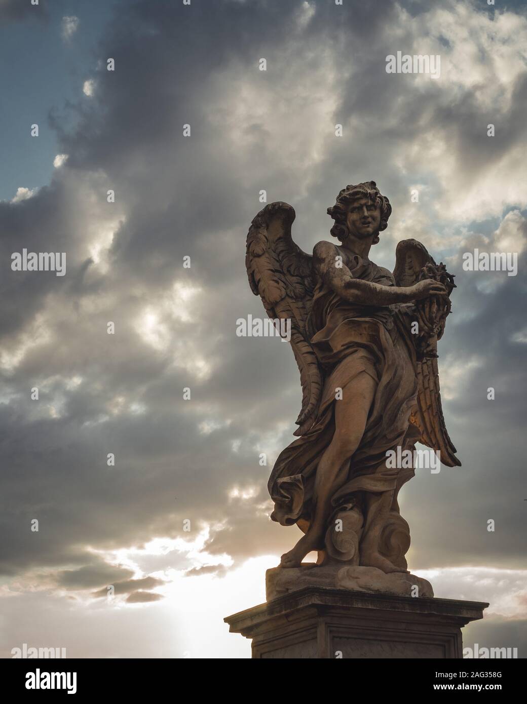 Victorian statue of an angel with an angry facial expression under the ...
