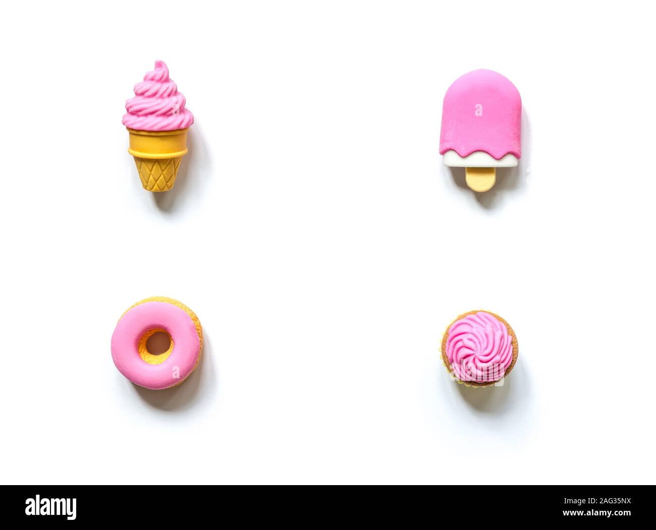 Different toy sweets in miniature with soft shadows close-up isolated ...