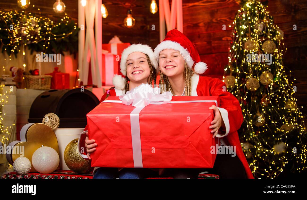 Winter masquerade. Happiness and joy. Girls friends sisters Santa claus ...