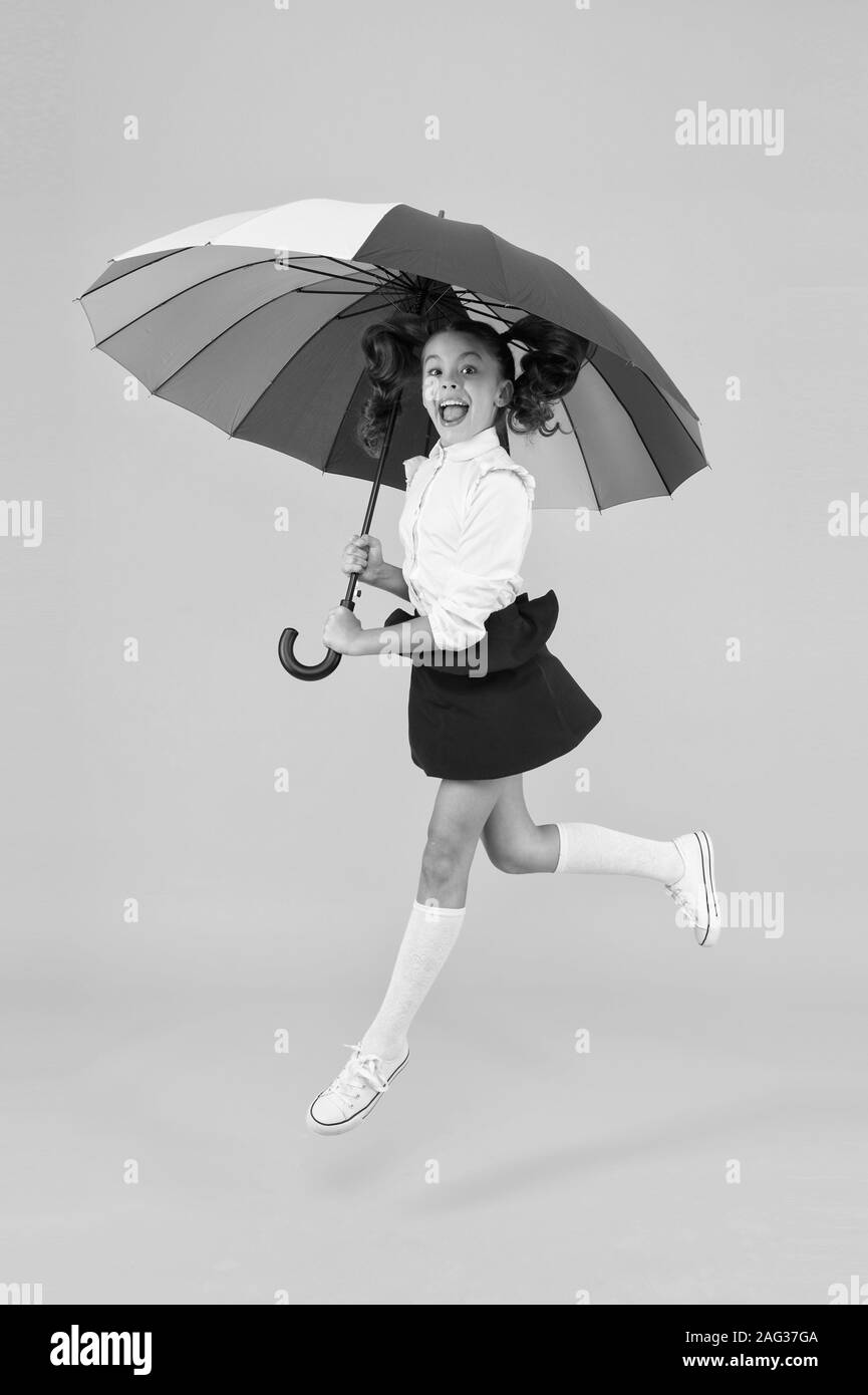 Fashion accessory. Umbrella protective shield. Girl with umbrella. Rainy day walks. Happy ...