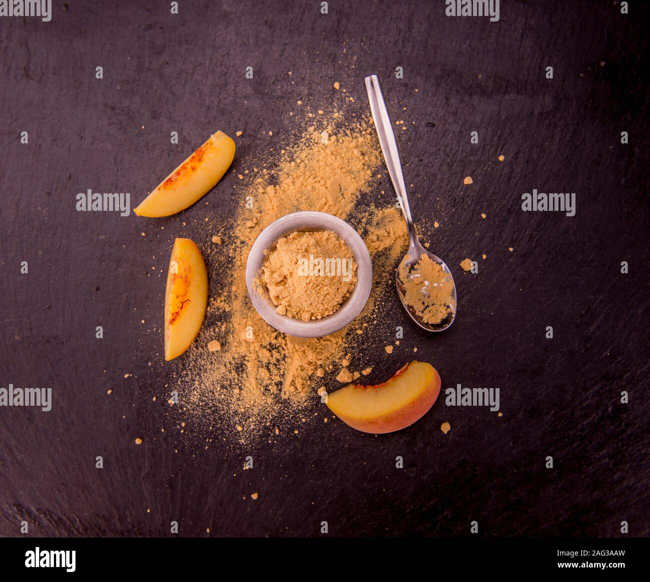 Peach powder on a vintage slate slab as detailed close-up shot ...