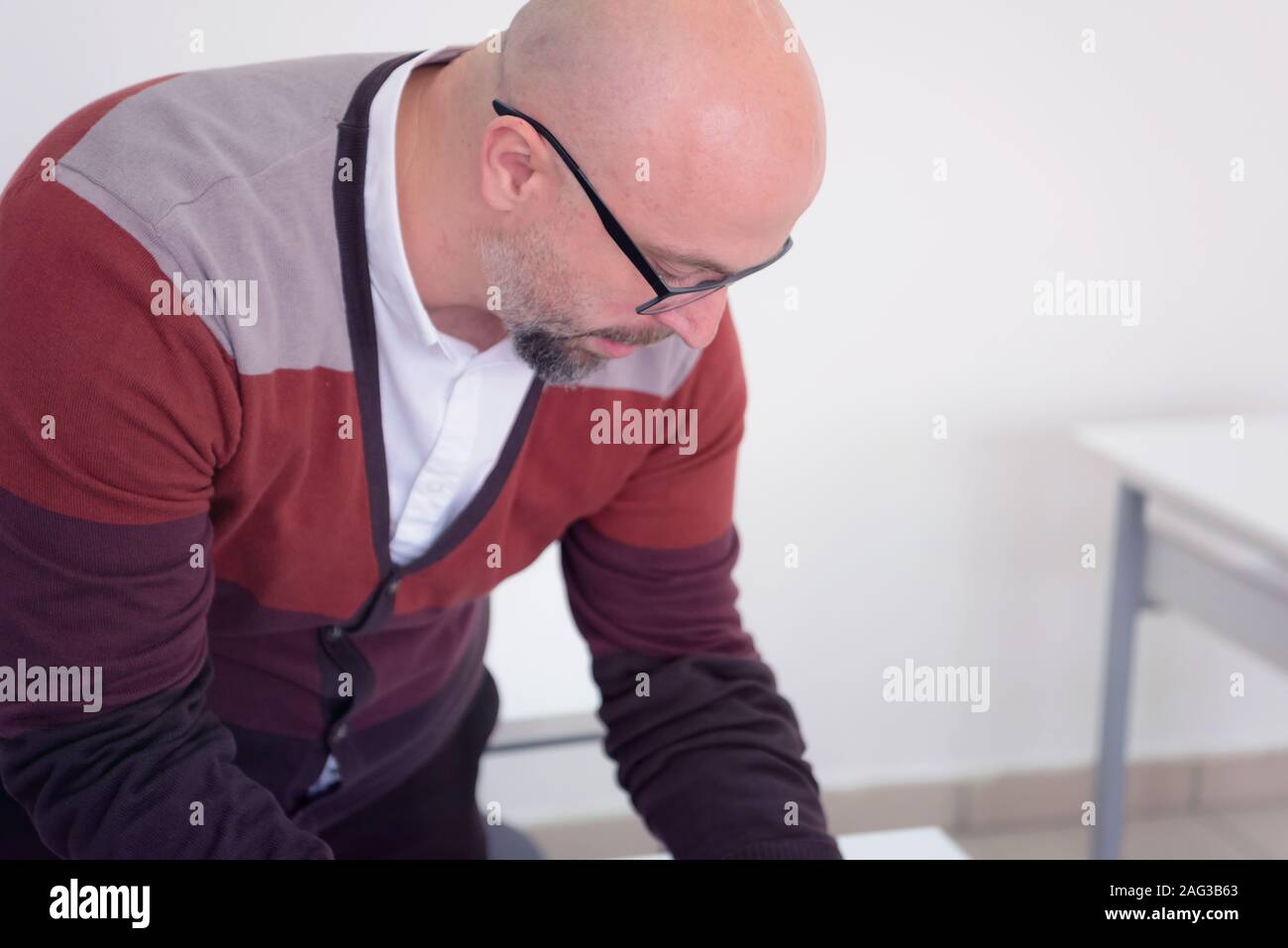 Male professor of architecture explain lesson to students and interact ...