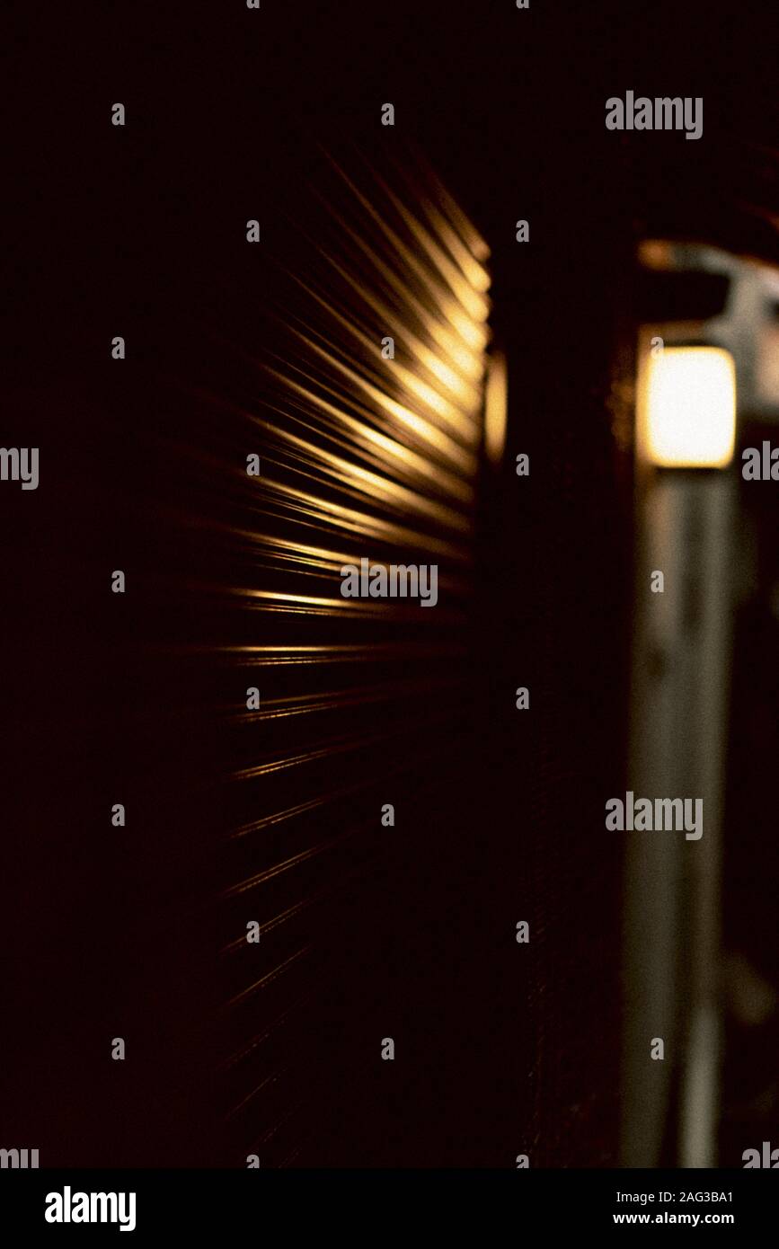 Vertical shot of a steel roller shutter reflecting the light with a ...