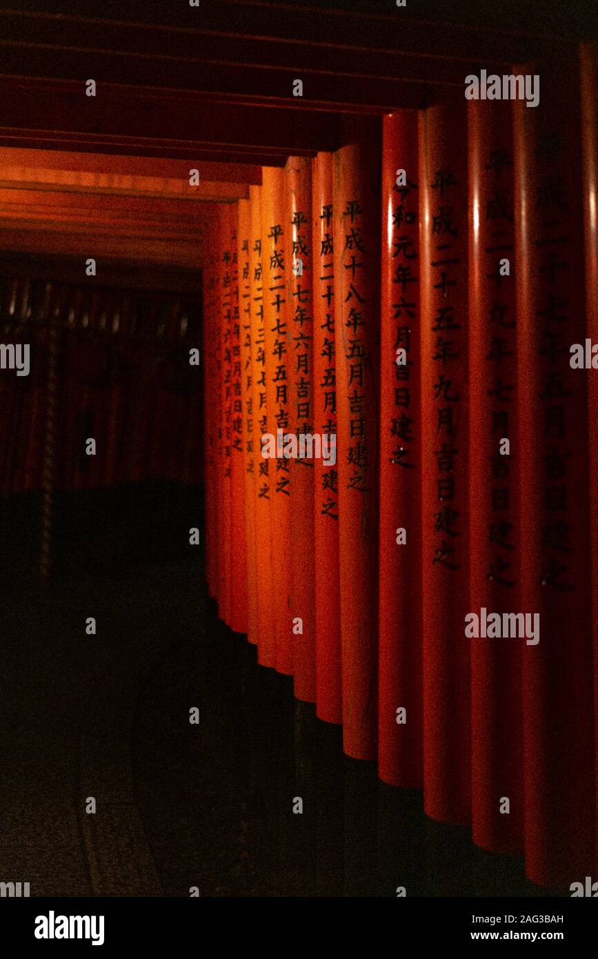 Vertical orange torii gates hi-res stock photography and images - Alamy