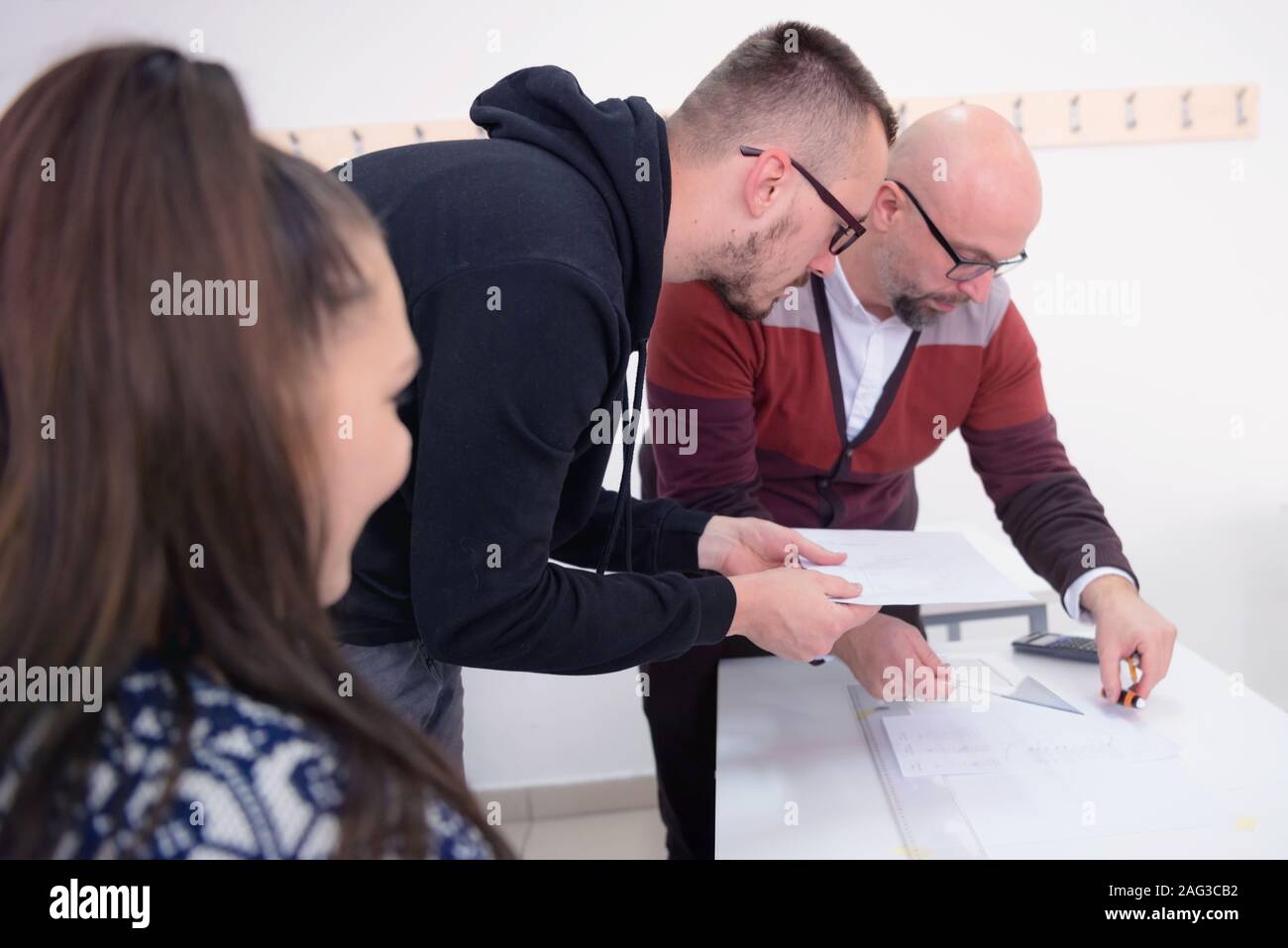 Male professor of architecture explain lesson to multiethnic students ...