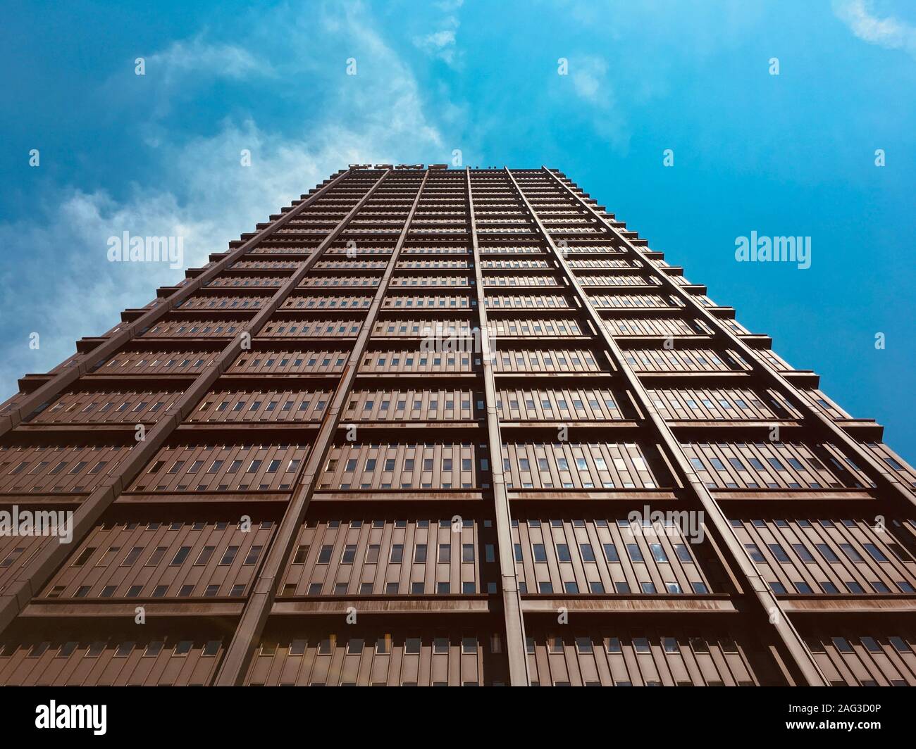 Low angle shot of a modern skyscraper with see-through windows under ...