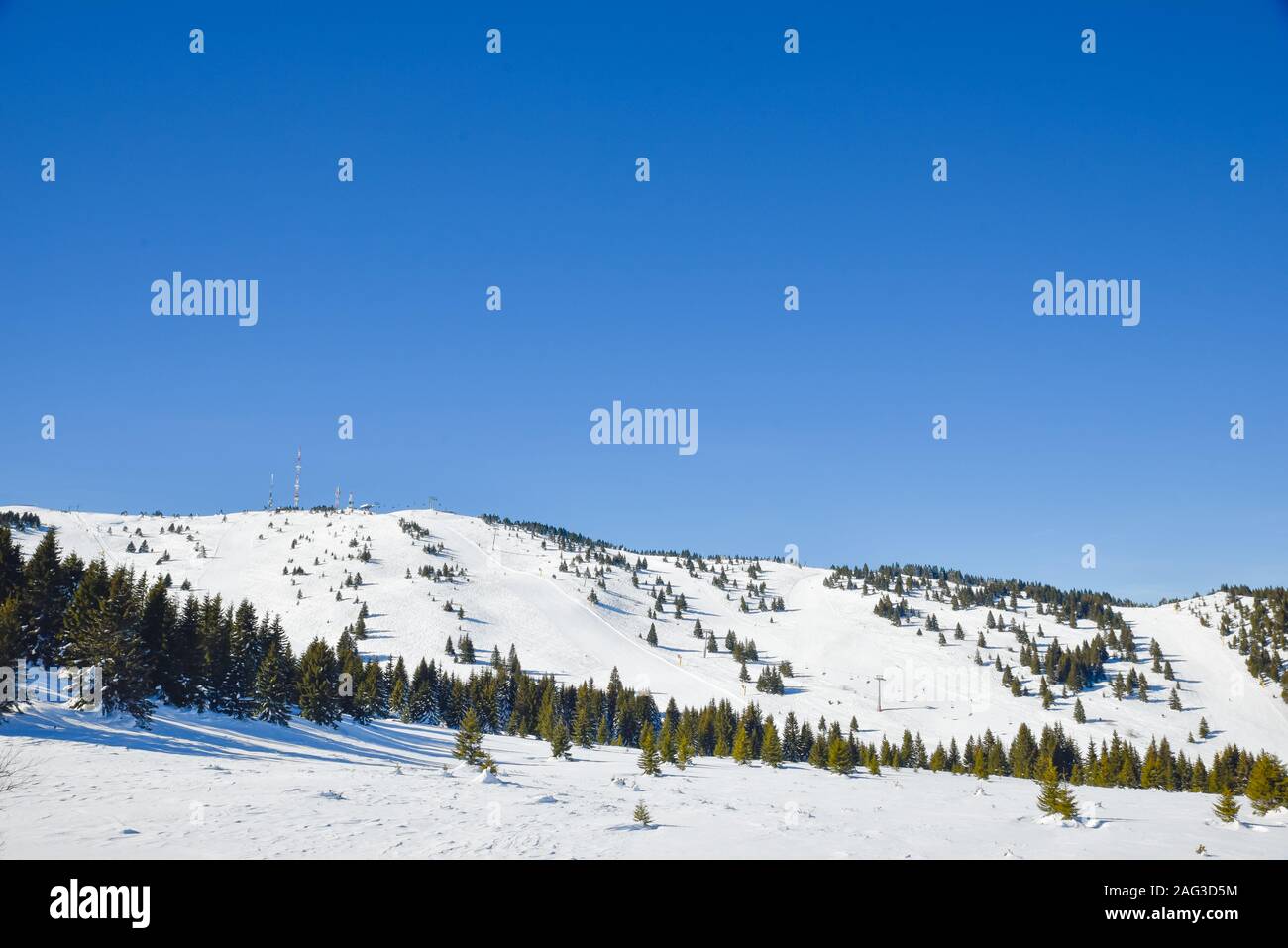 Wider image of the Kopaonik Mountain ski slopes in Serbia and one of ...