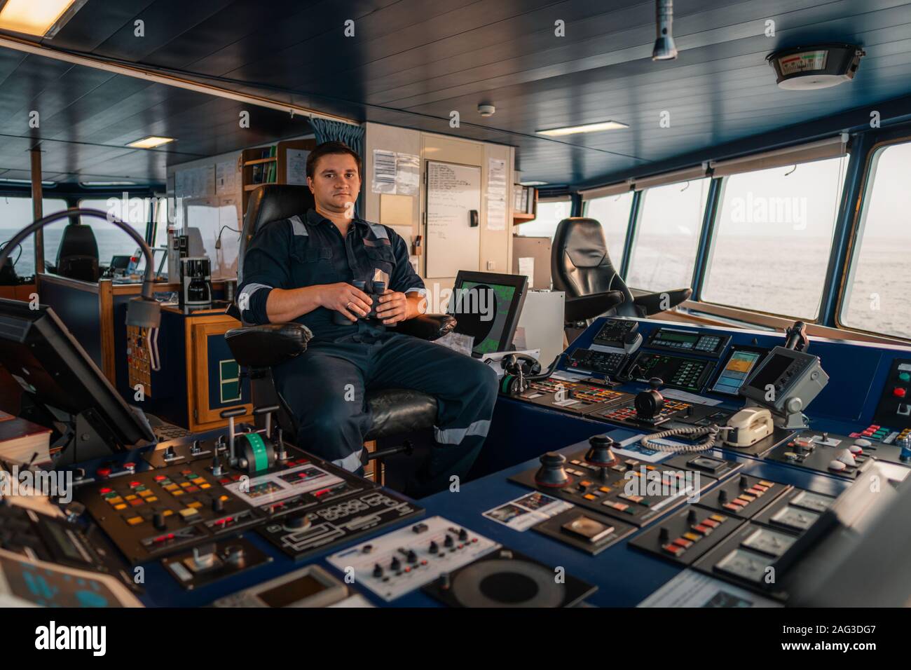 Marine navigational officer during navigational watch on Bridge . Work ...