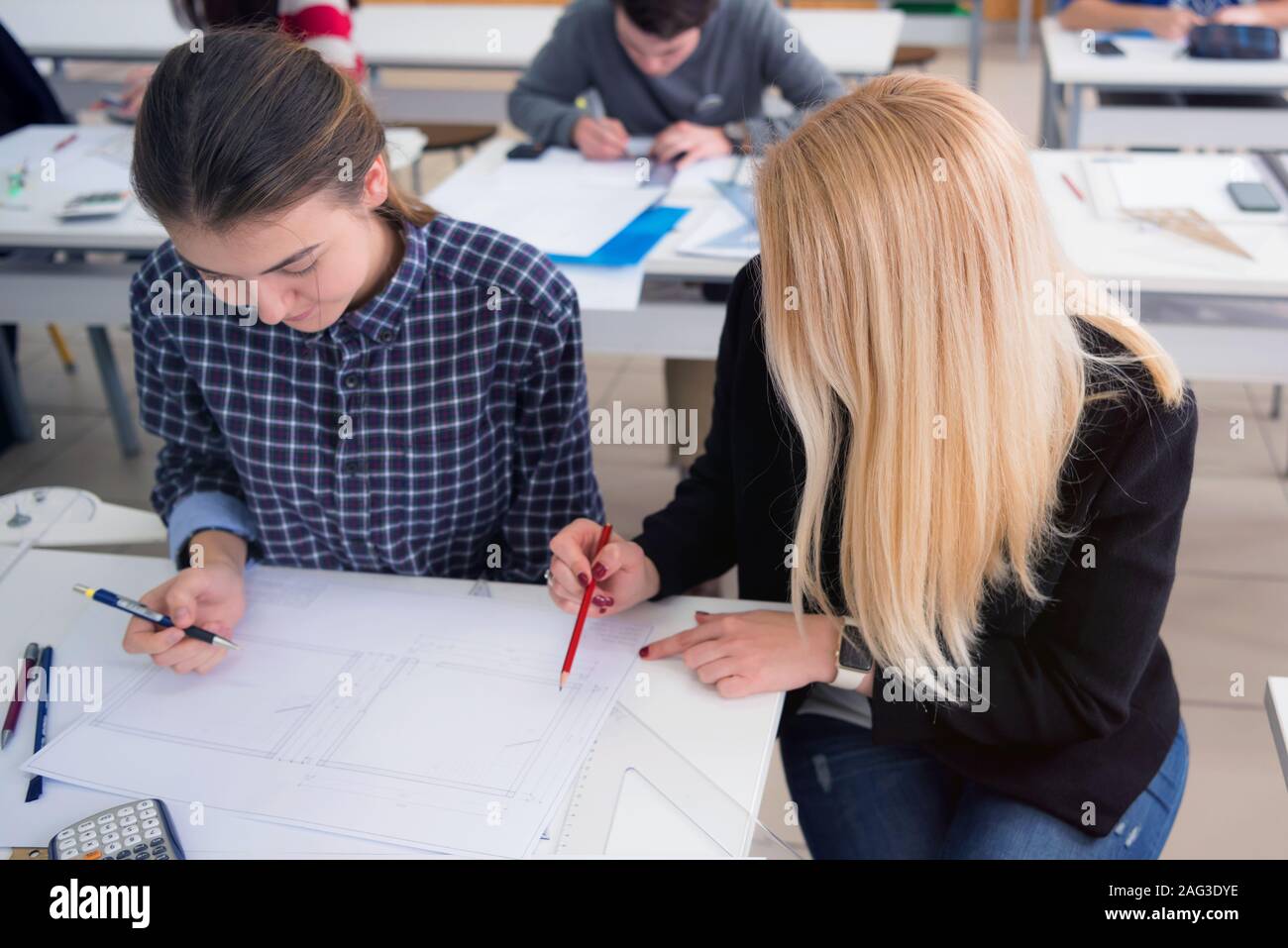 Female Architecture teacher at work. Female professor explain ...