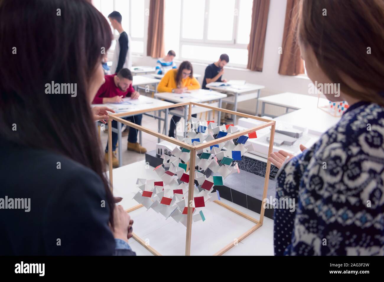 Female Architecture teacher at work. Female professor explain ...