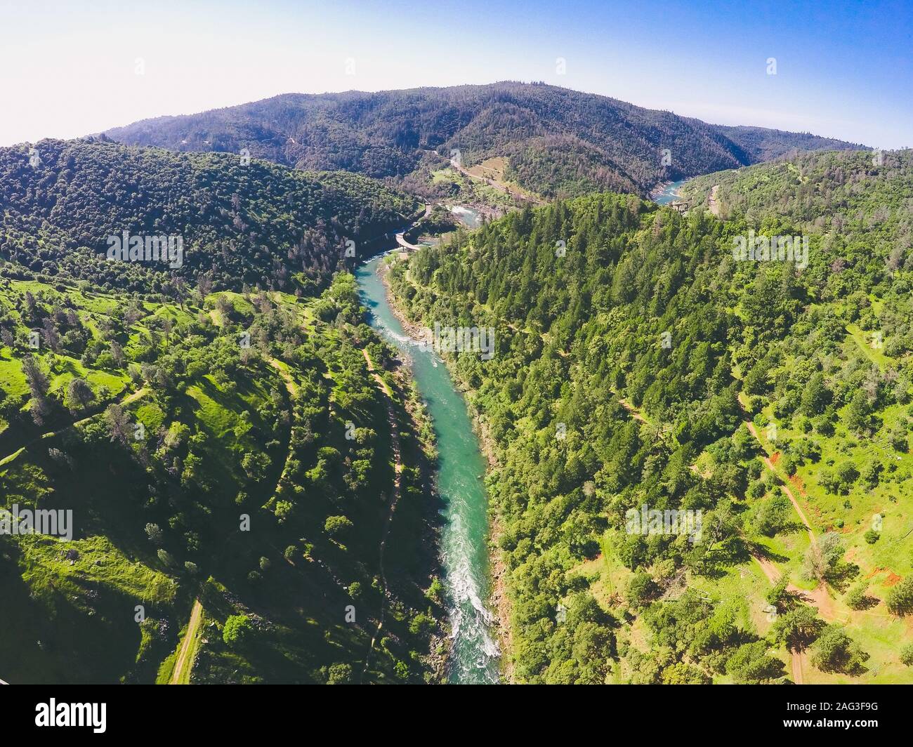 Beautiful scenery of a narrow river between the mountains with a lot of ...