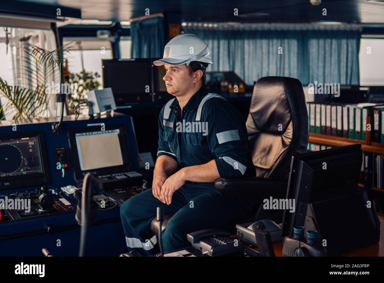Marine navigational officer during navigational watch on Bridge . Work ...