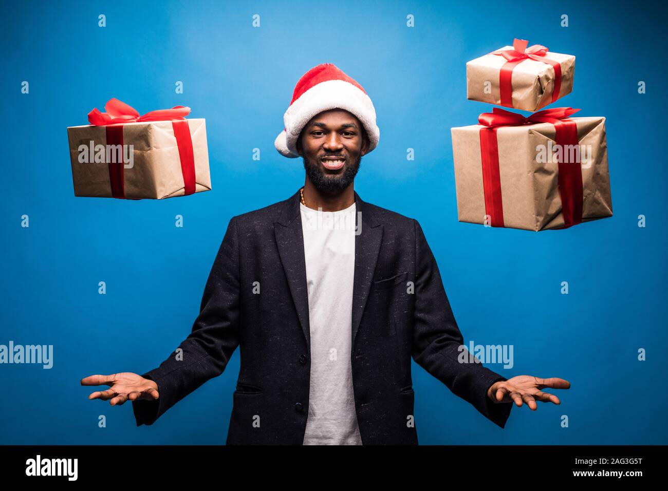 Santa claus throwing gift hi-res stock photography and images - Alamy