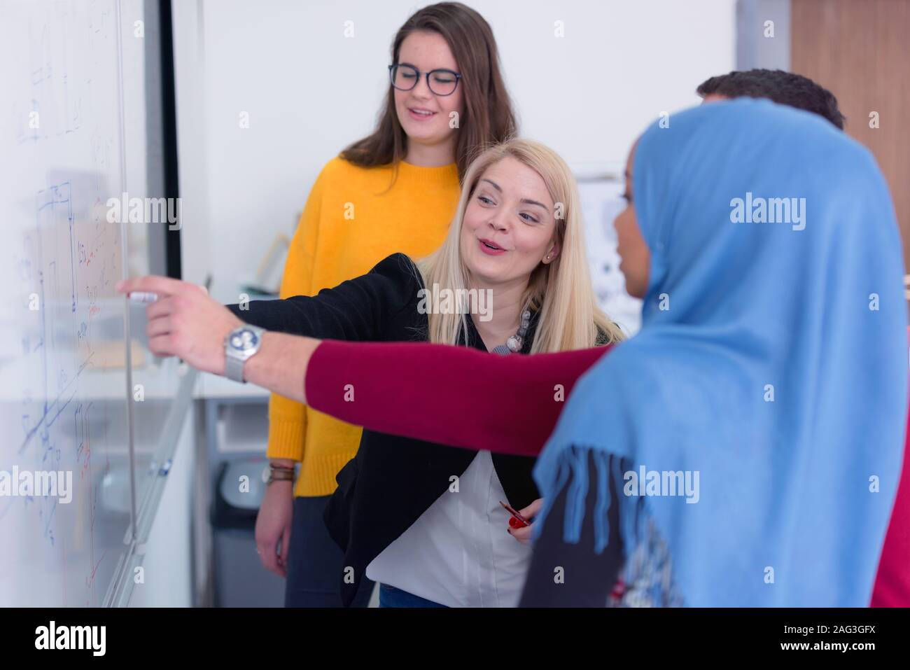 Female Architecture teacher at work. Female professor explain ...