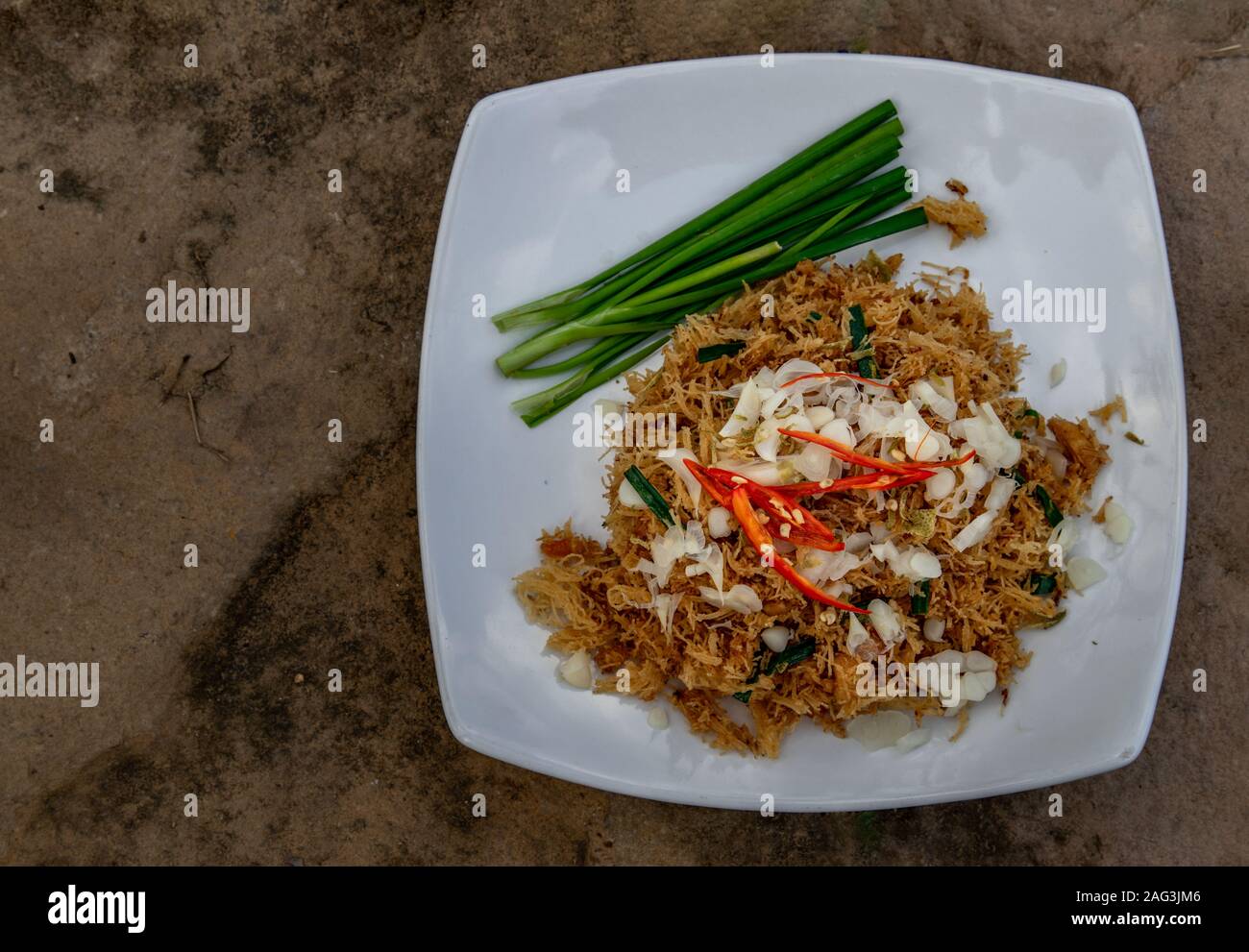 Asian eating food, Mee Grob is an sweet and sour crispy noodles, made ...